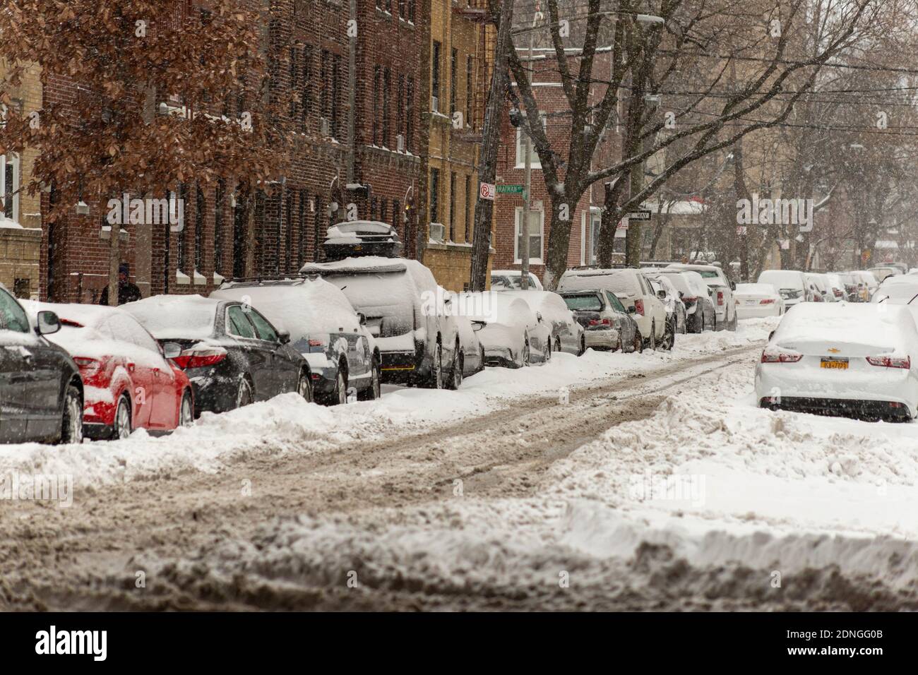 A residential street in the Bronx, NY, has been plowed during a heaving ...