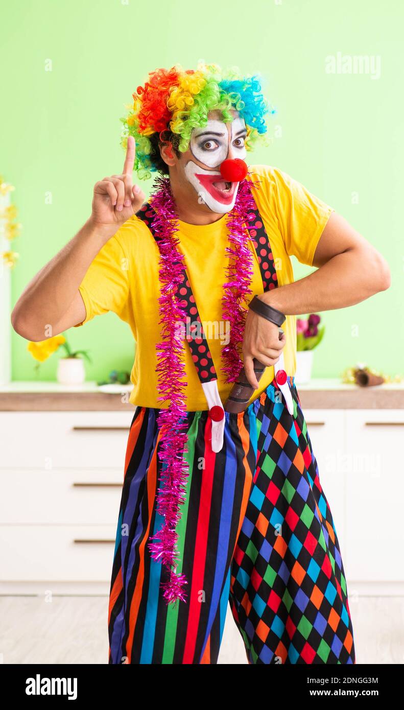 The funny clown in christmas celebration concept Stock Photo - Alamy