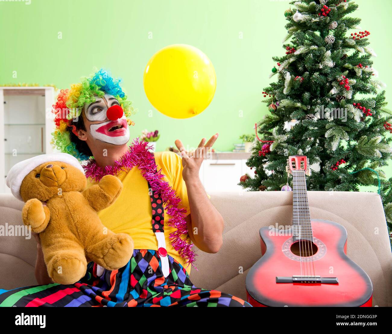 The funny clown in christmas celebration concept Stock Photo - Alamy