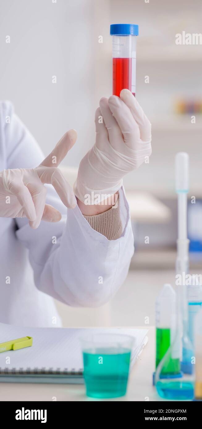 The woman doctor checking blood samples in lab Stock Photo - Alamy
