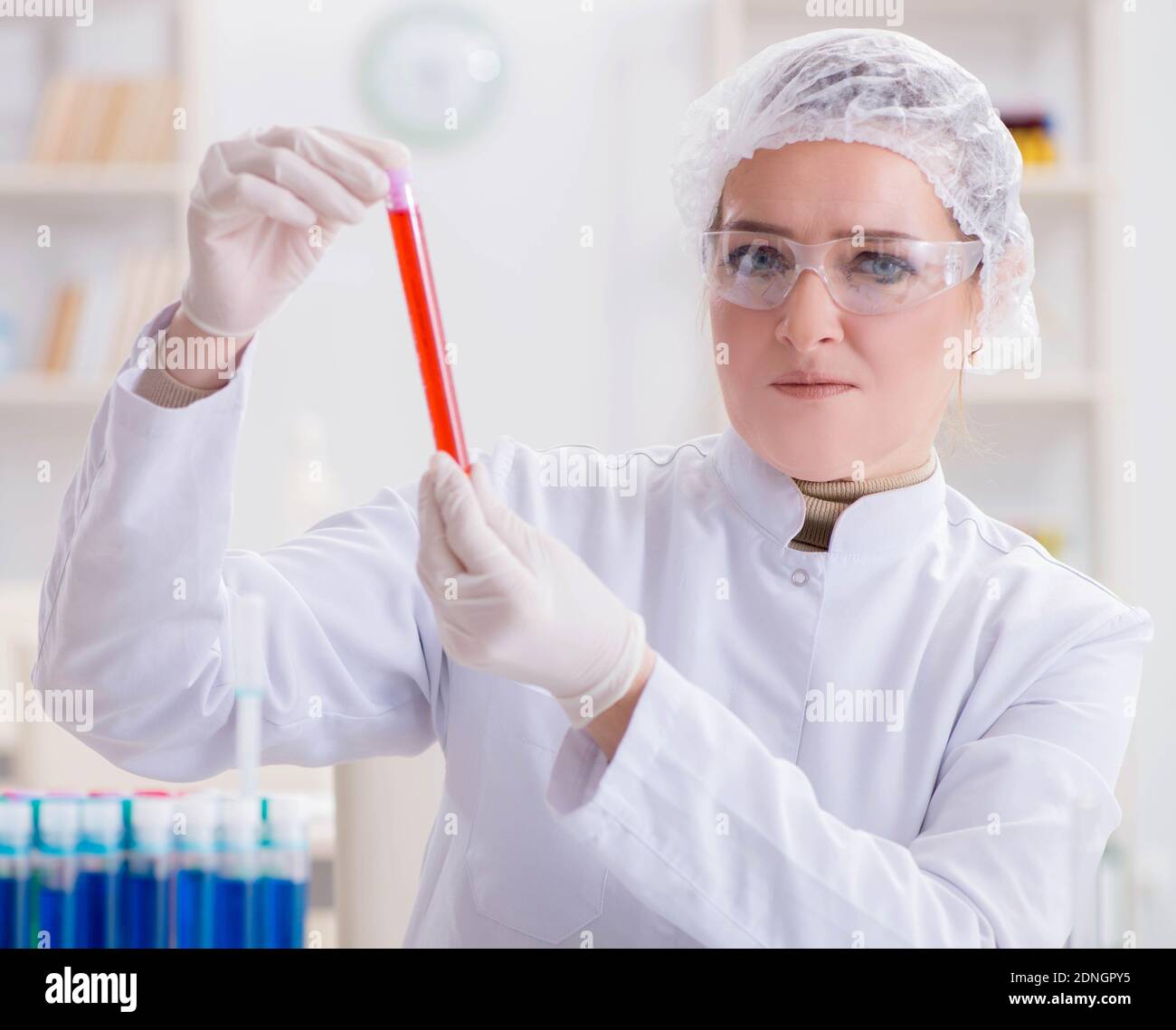 The woman doctor checking blood samples in lab Stock Photo - Alamy