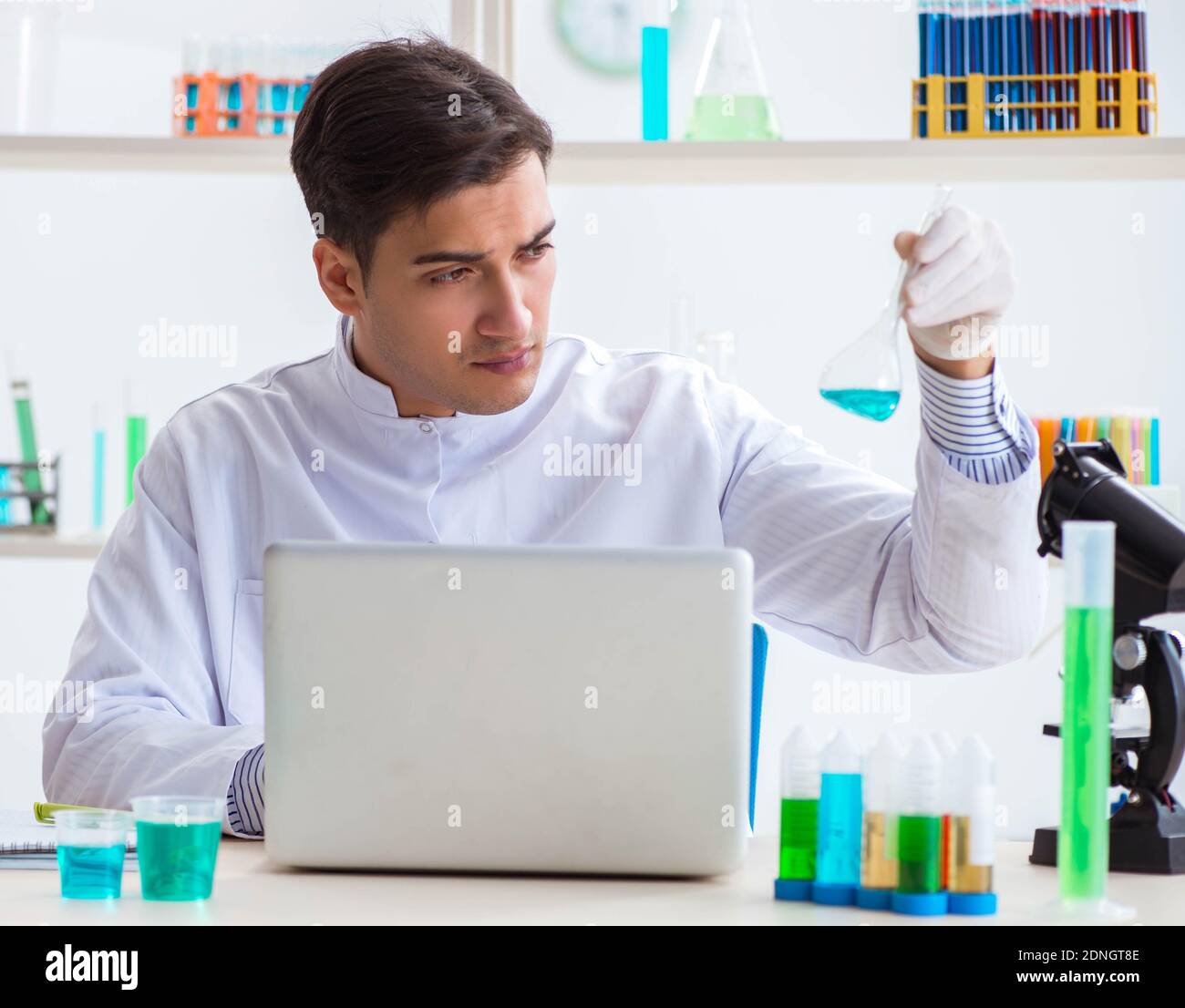 The man student working in chemical lab on experiment Stock Photo - Alamy