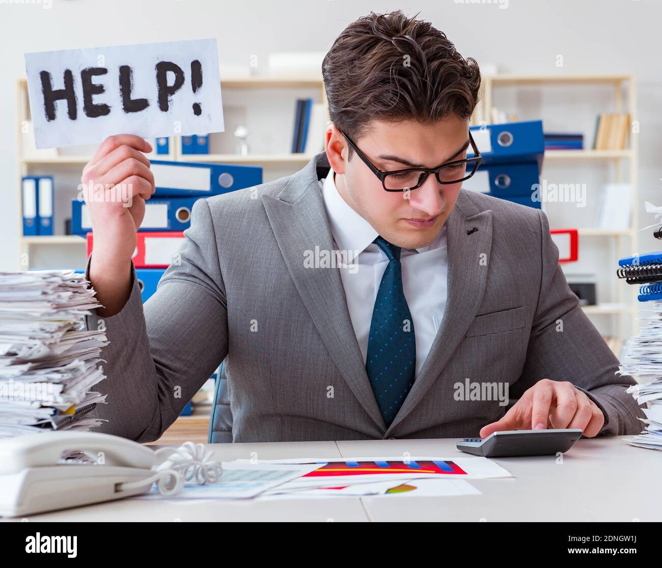 The businessman missing deadlines due to excessive work Stock Photo - Alamy
