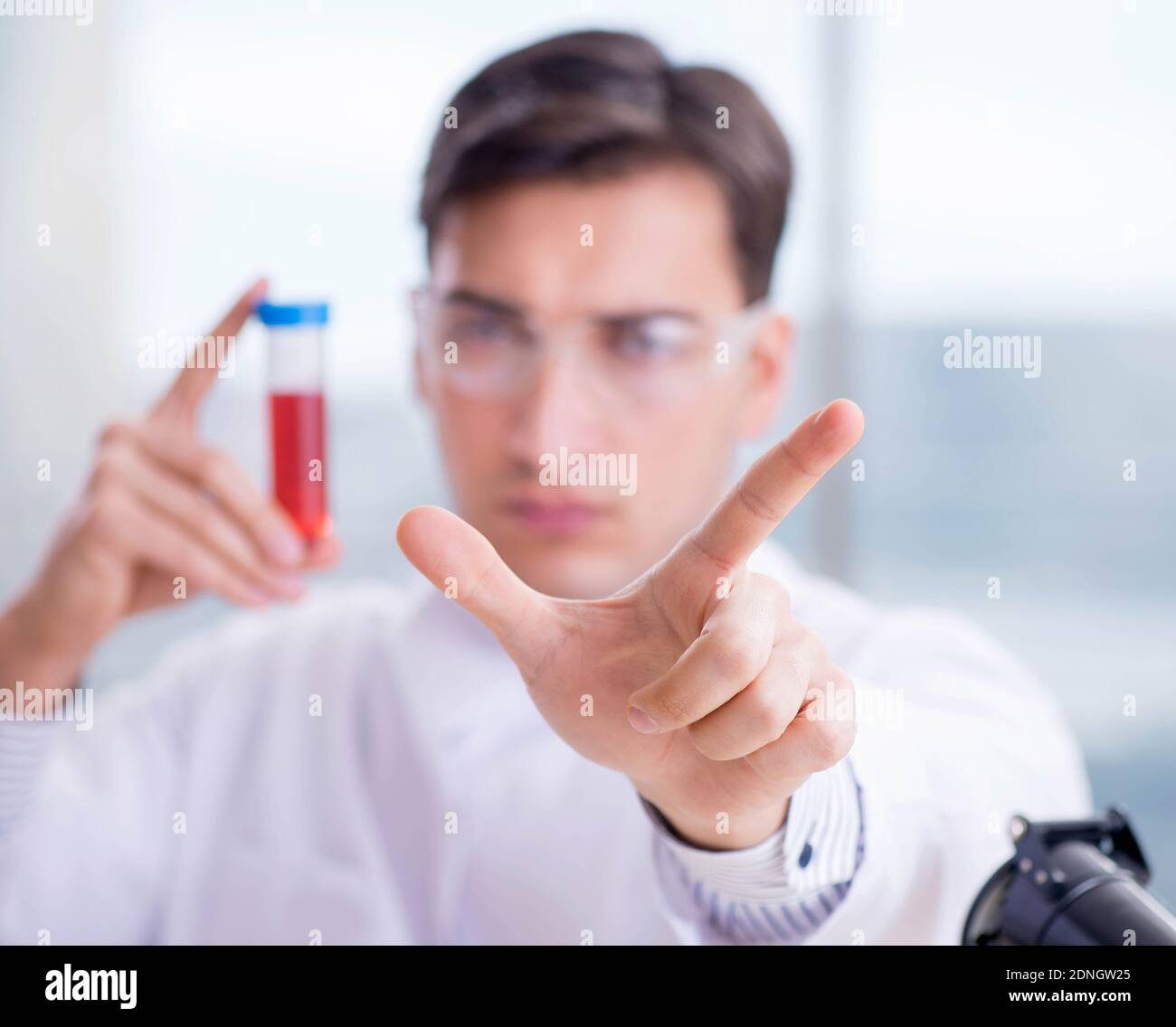 The man doctor checking blood samples in lab Stock Photo - Alamy