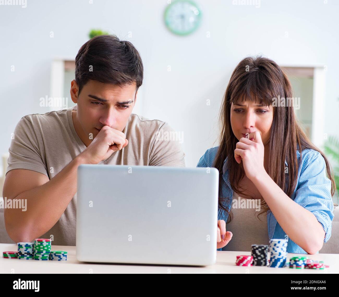 The family of wife and husband gambling online Stock Photo - Alamy