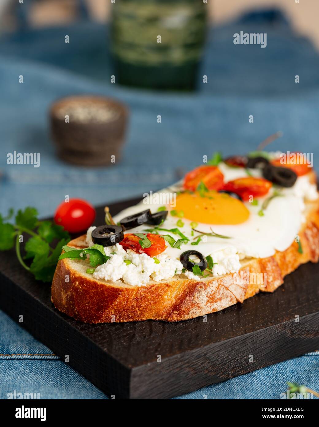 Toasted bread toast with fried eggs with yellow yolk and tomatoes ...