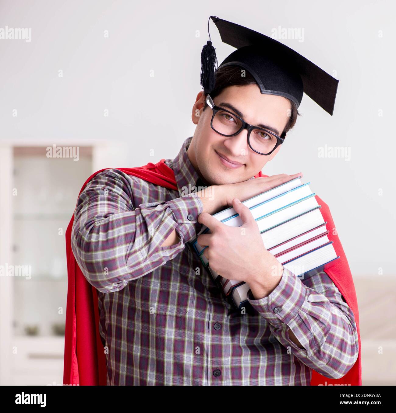The super hero student with books studying for exams Stock Photo - Alamy