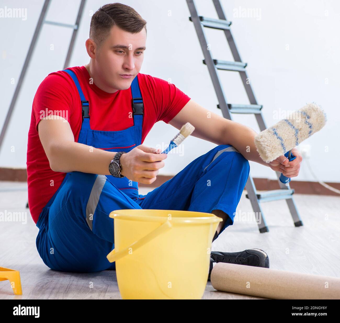 The male painter preparing for painting job at construction site Stock ...