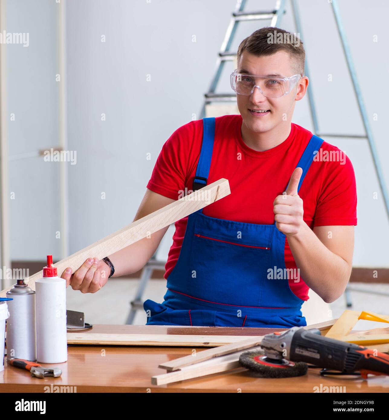 The contractor working in the workshop Stock Photo - Alamy