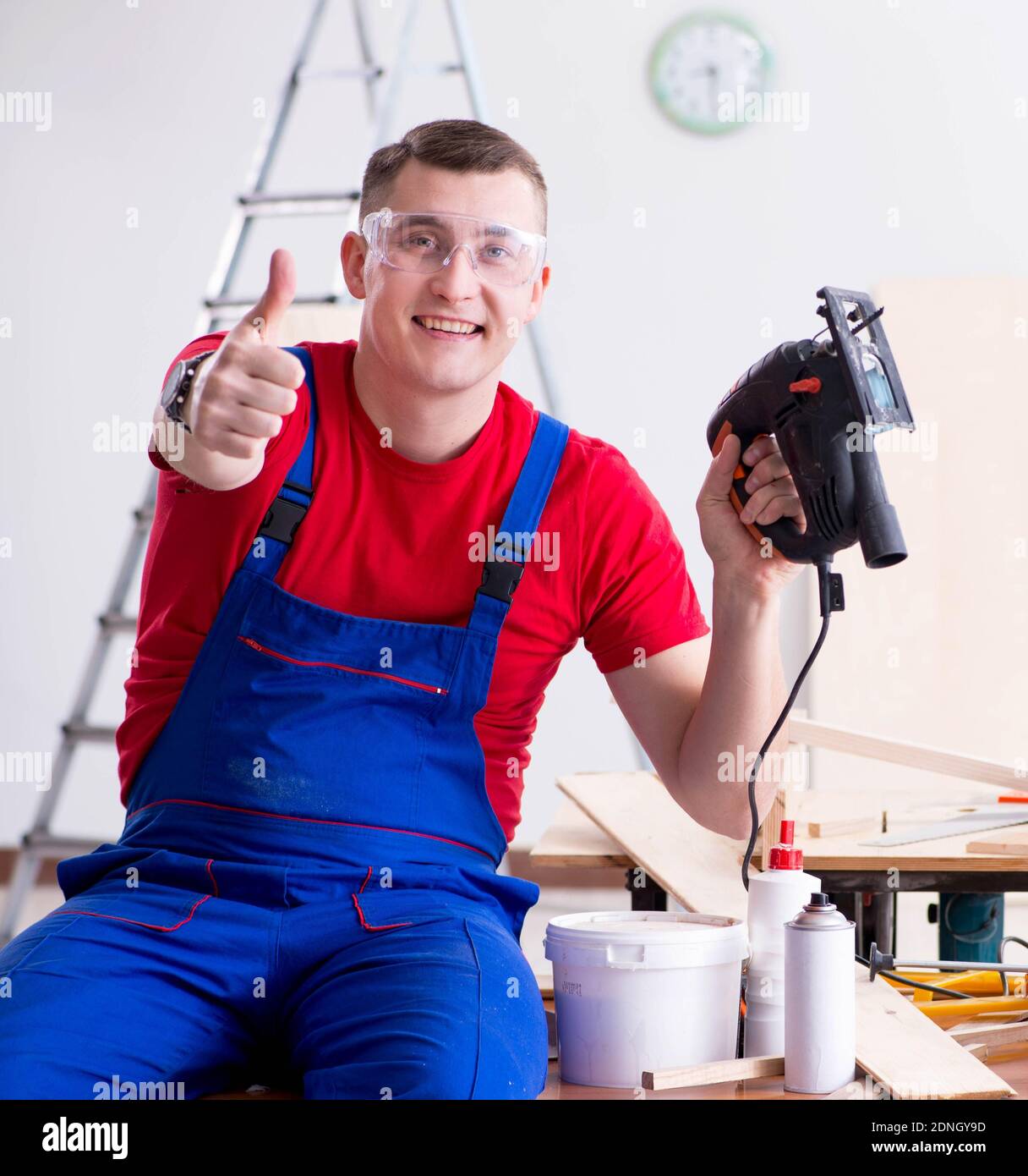 The contractor working in the workshop Stock Photo - Alamy
