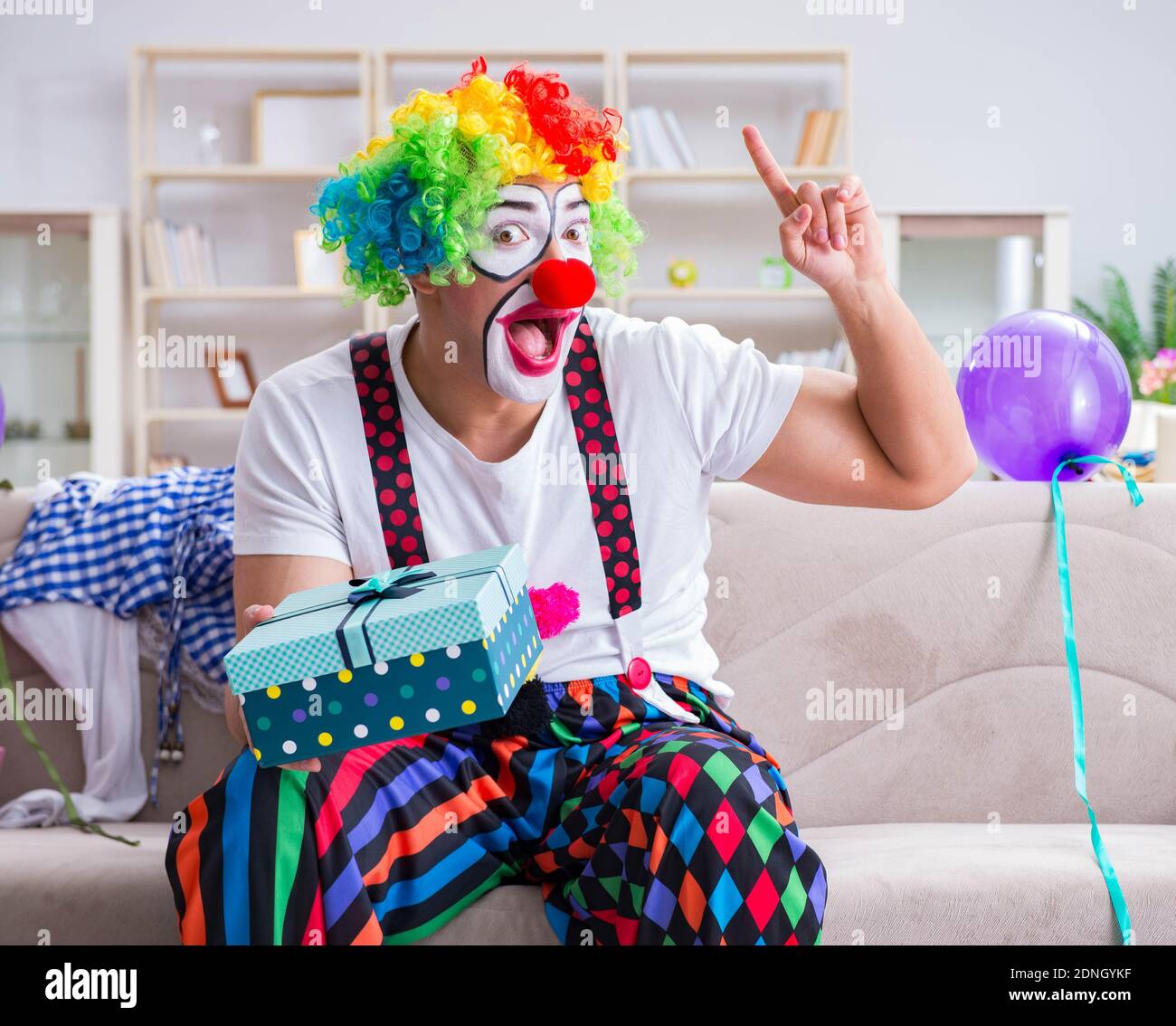 The drunk clown celebrating having a party at home Stock Photo - Alamy