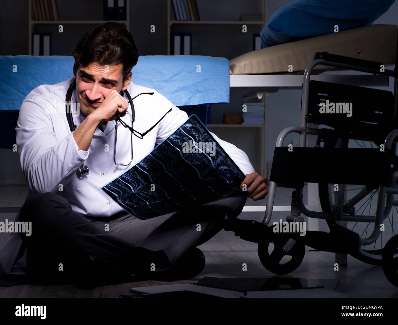 The doctor working night shift in hospital after long hours Stock Photo ...
