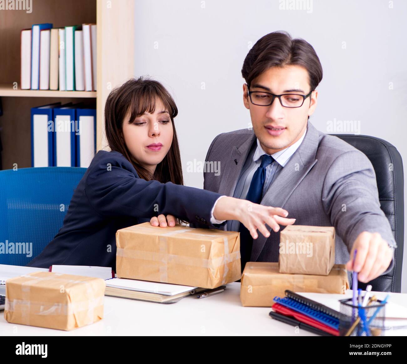 The business people receiving new mail and parcels Stock Photo - Alamy