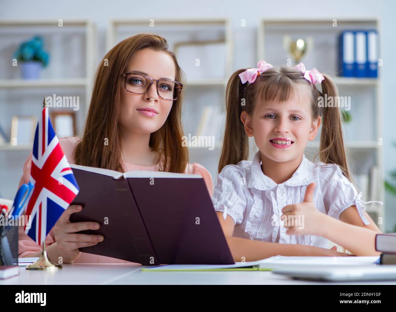 The young girl learning english with teacher Stock Photo - Alamy