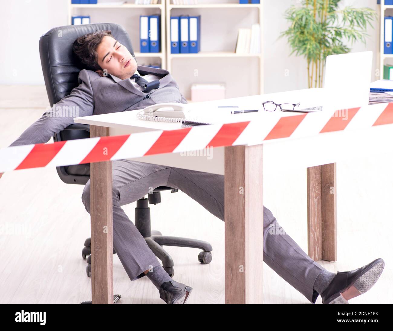 The dead businessman at this desk Stock Photo - Alamy