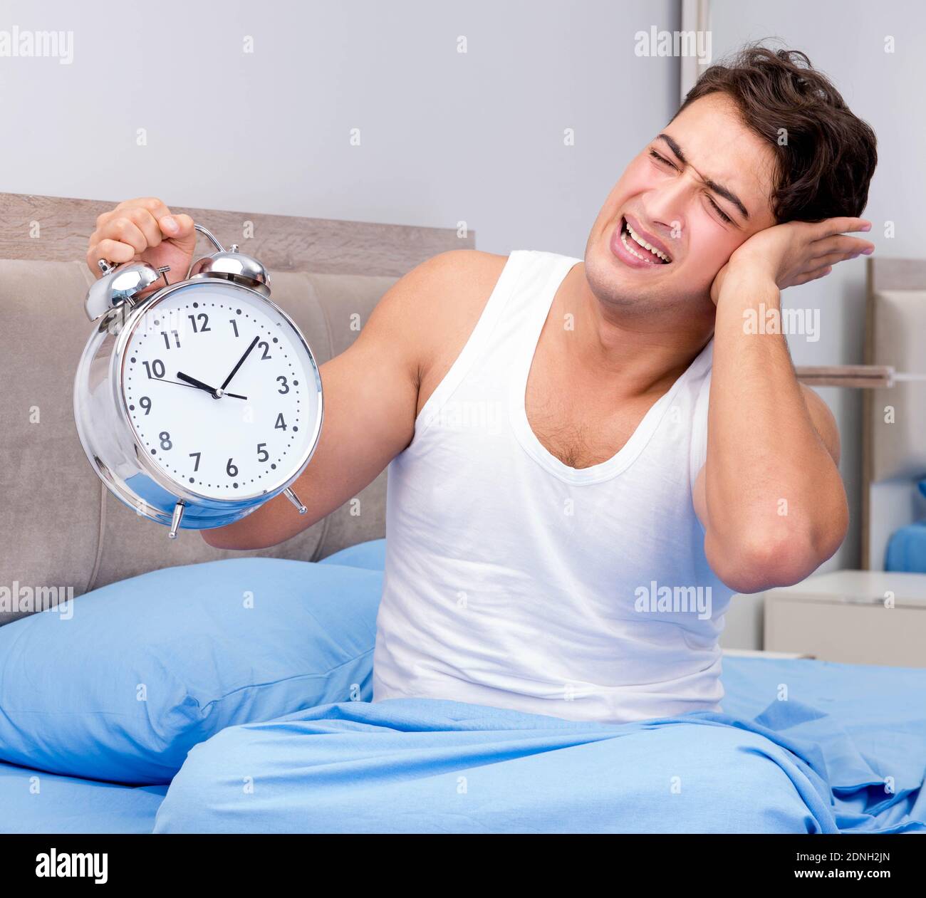 The man having trouble waking up in morning Stock Photo - Alamy