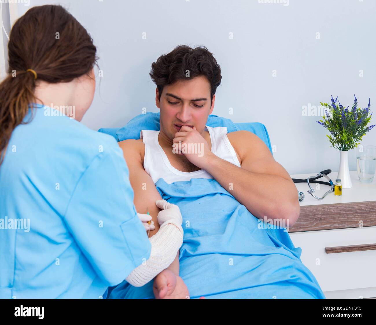 The doctor doing medical injection in hospital room Stock Photo - Alamy