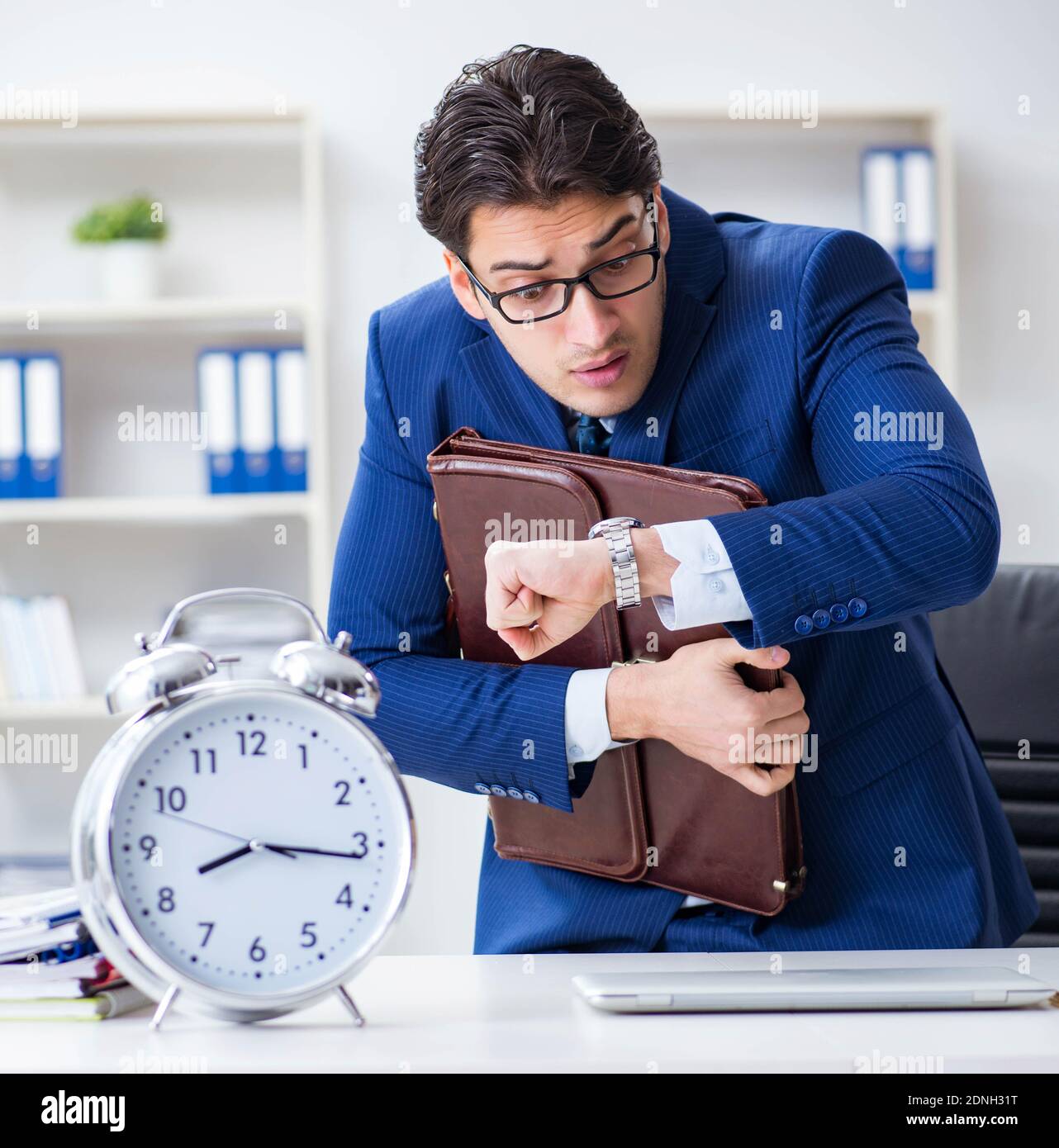 The businessman in bad time management concept Stock Photo - Alamy
