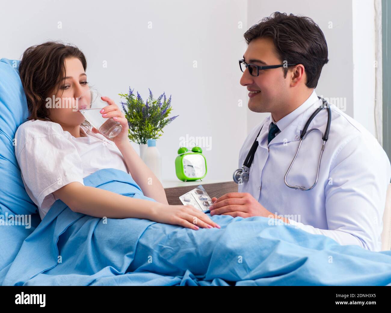 The doctor visiting patient in hospital room Stock Photo - Alamy
