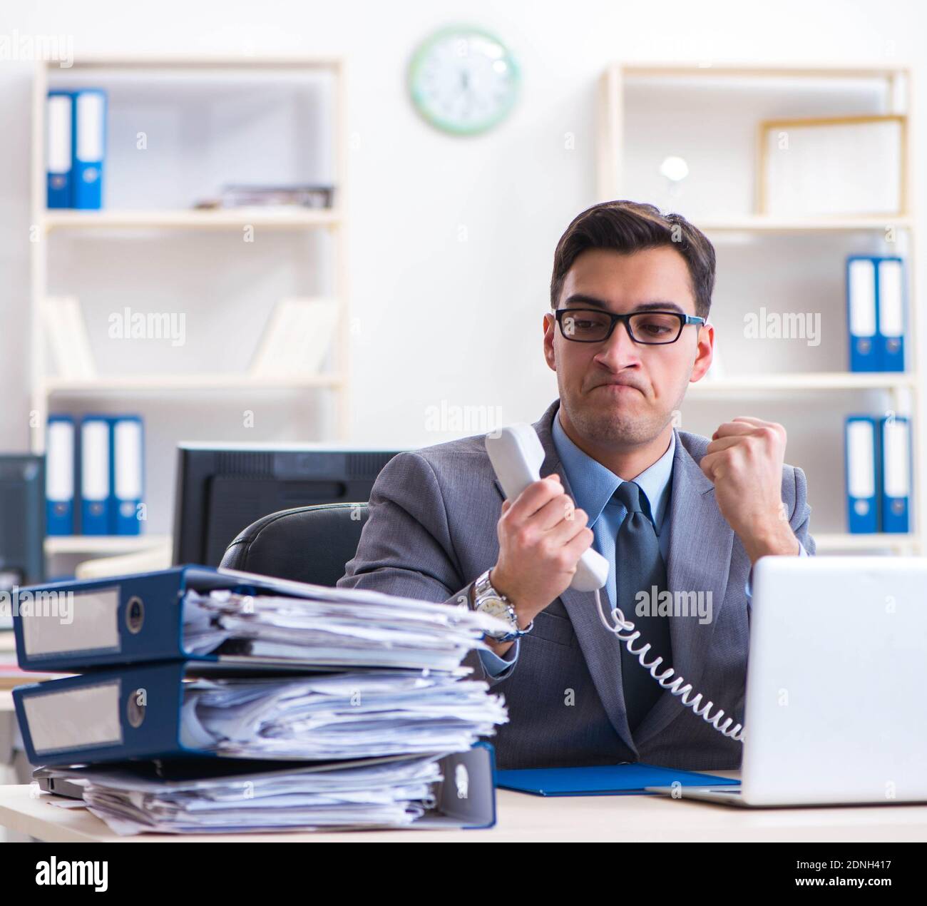 The desperate sad employee tired at his desk in call center Stock Photo ...