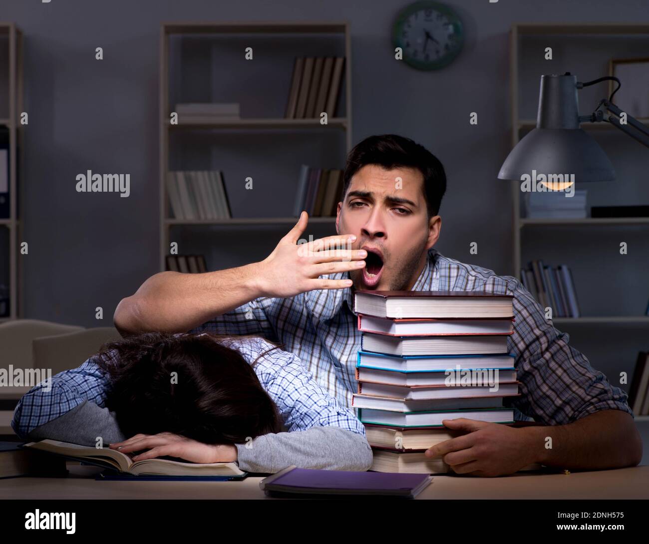 The two students studying late at night Stock Photo - Alamy