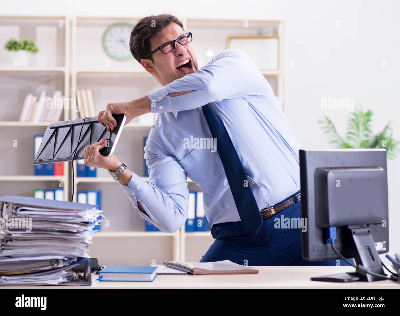 The angry businessman frustrated with too much work Stock Photo - Alamy