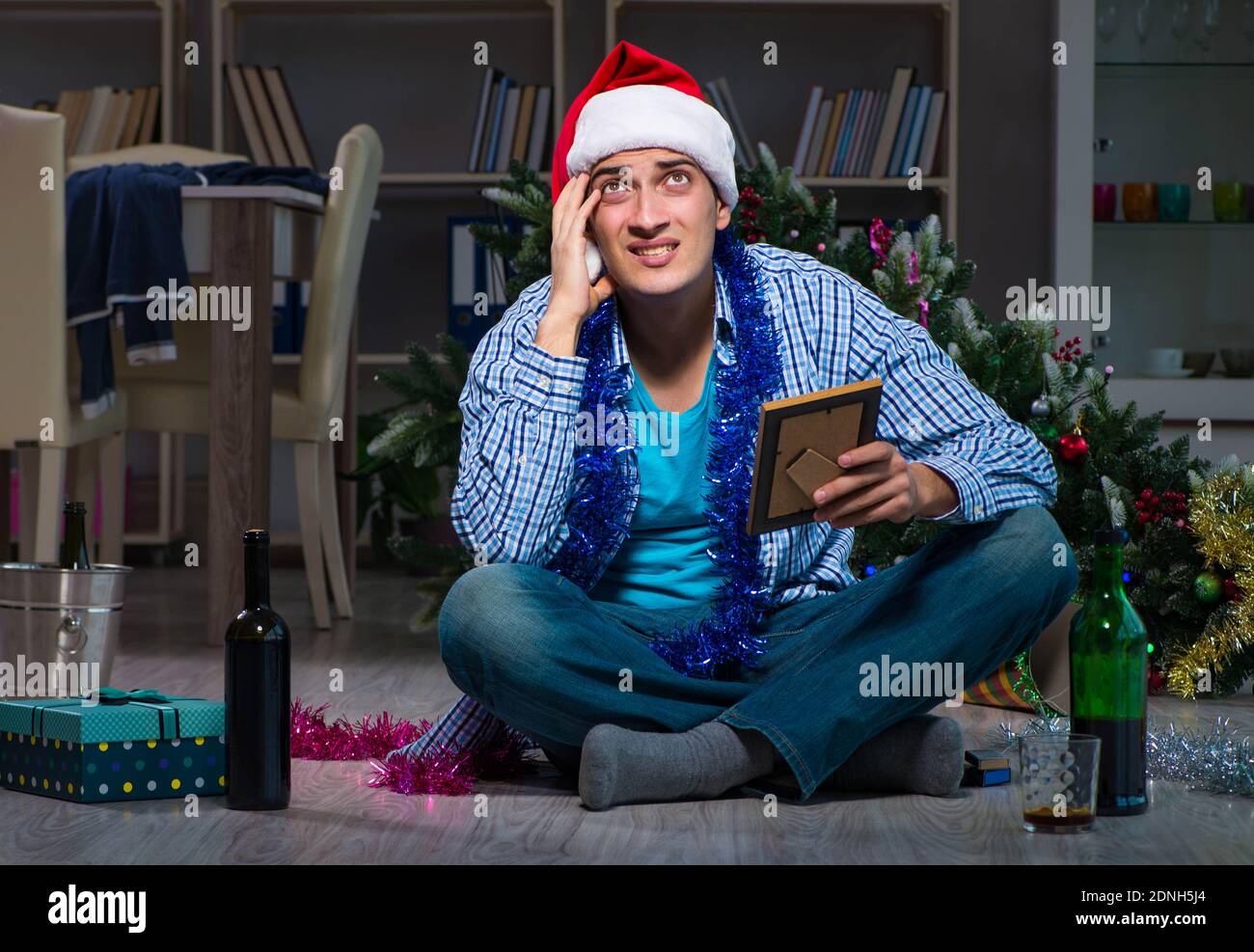 The man celebrating christmas at home alone Stock Photo - Alamy