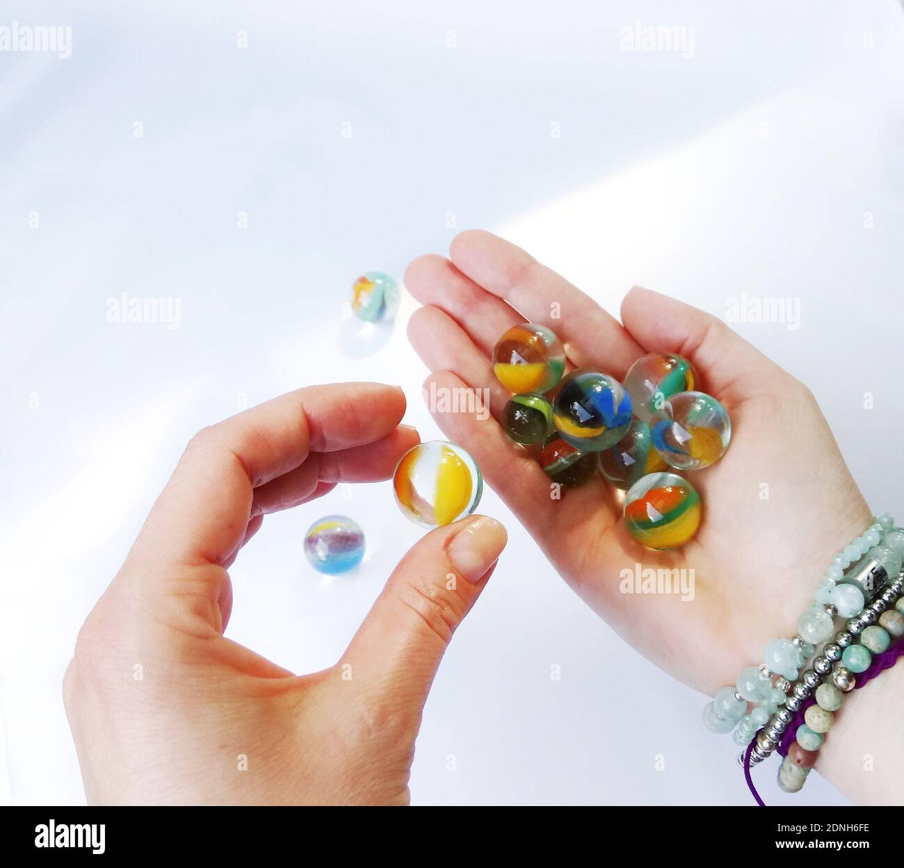 Hand Holding Marbles High Resolution Stock Photography and Images - Alamy