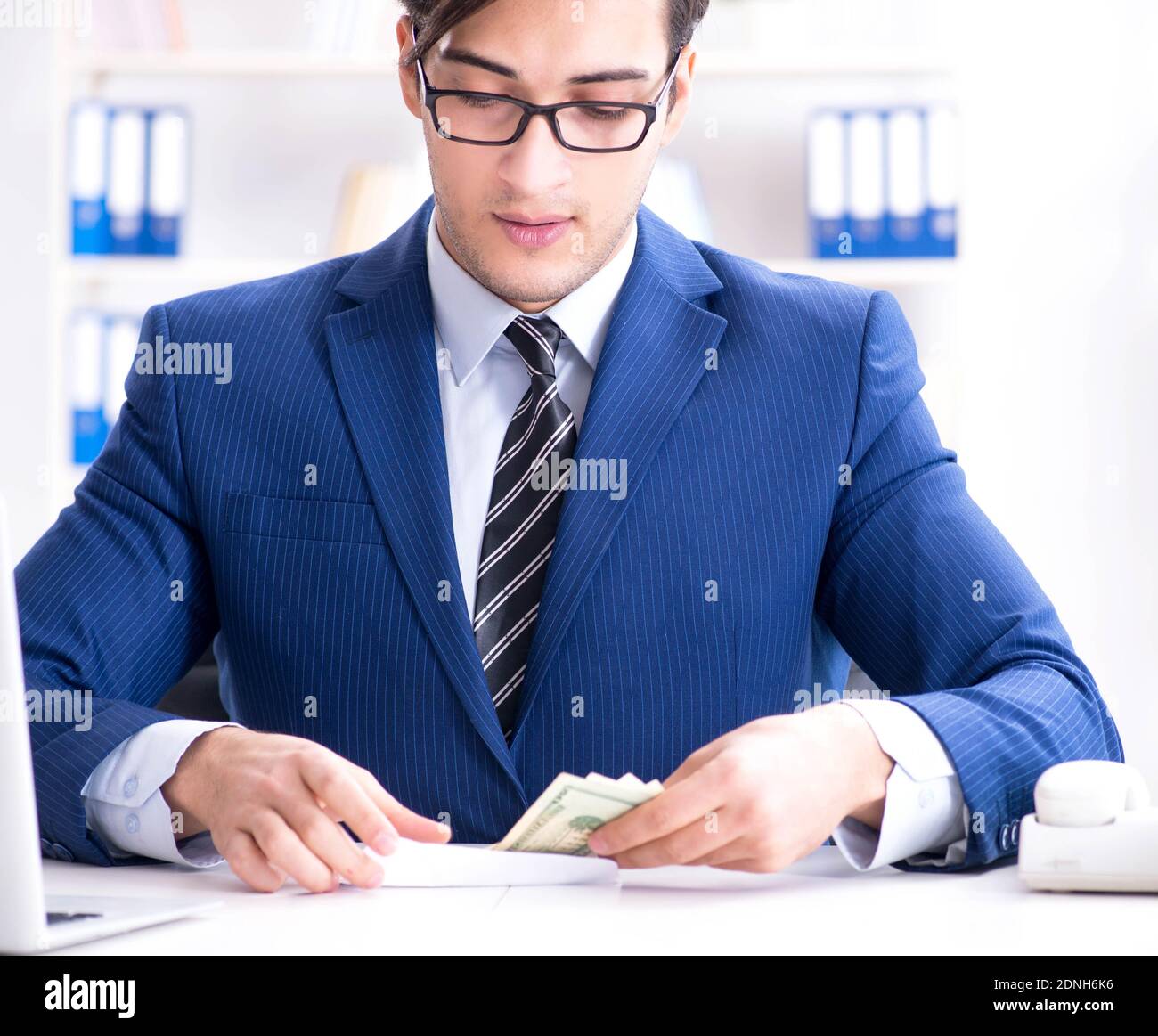 The businessman receiving his salary and bonus Stock Photo - Alamy