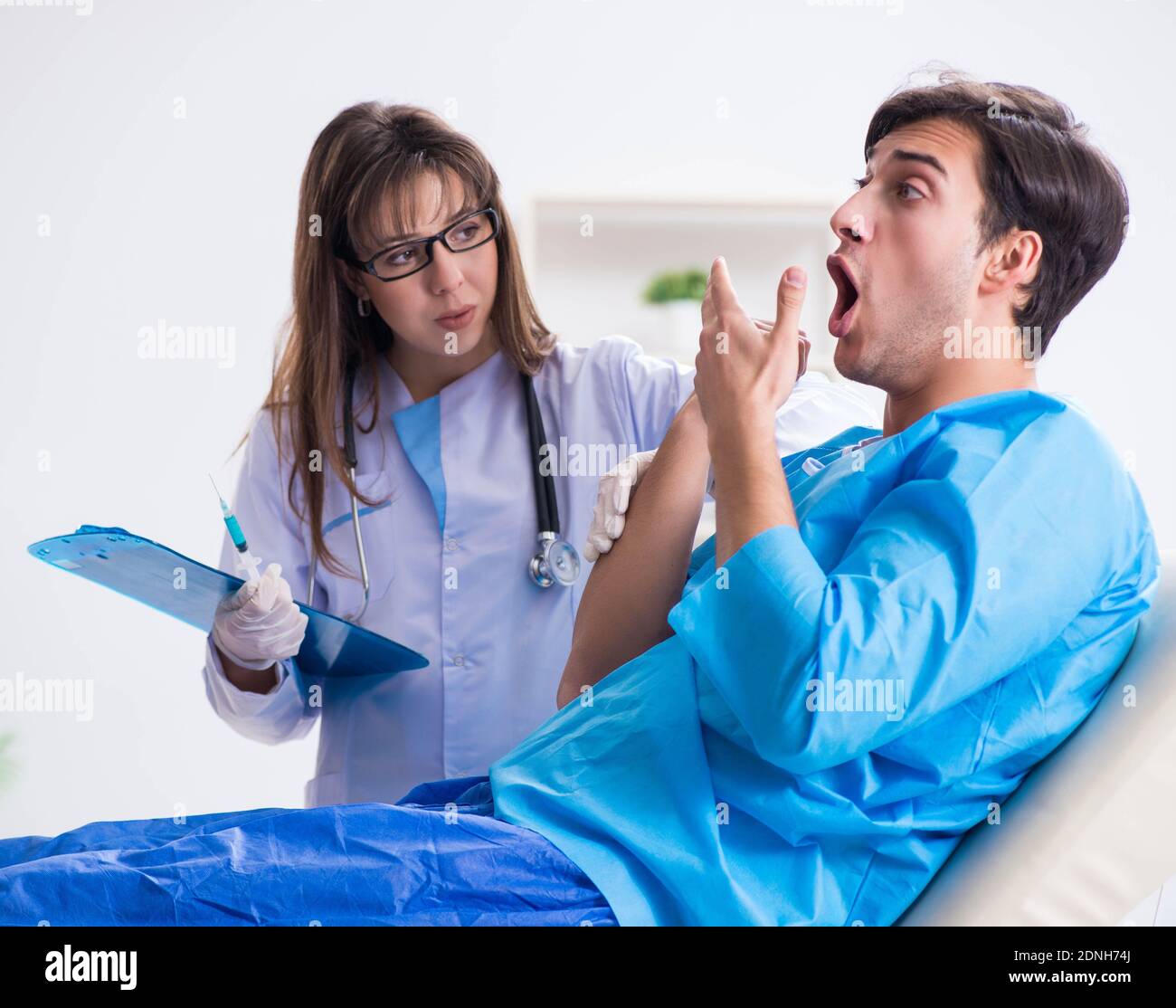 The scared patient man getting ready for flu shot Stock Photo - Alamy