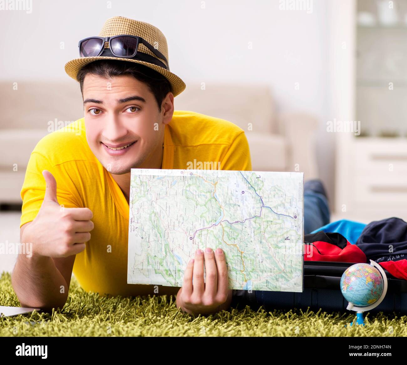 The man planning his vacation trip with map Stock Photo - Alamy