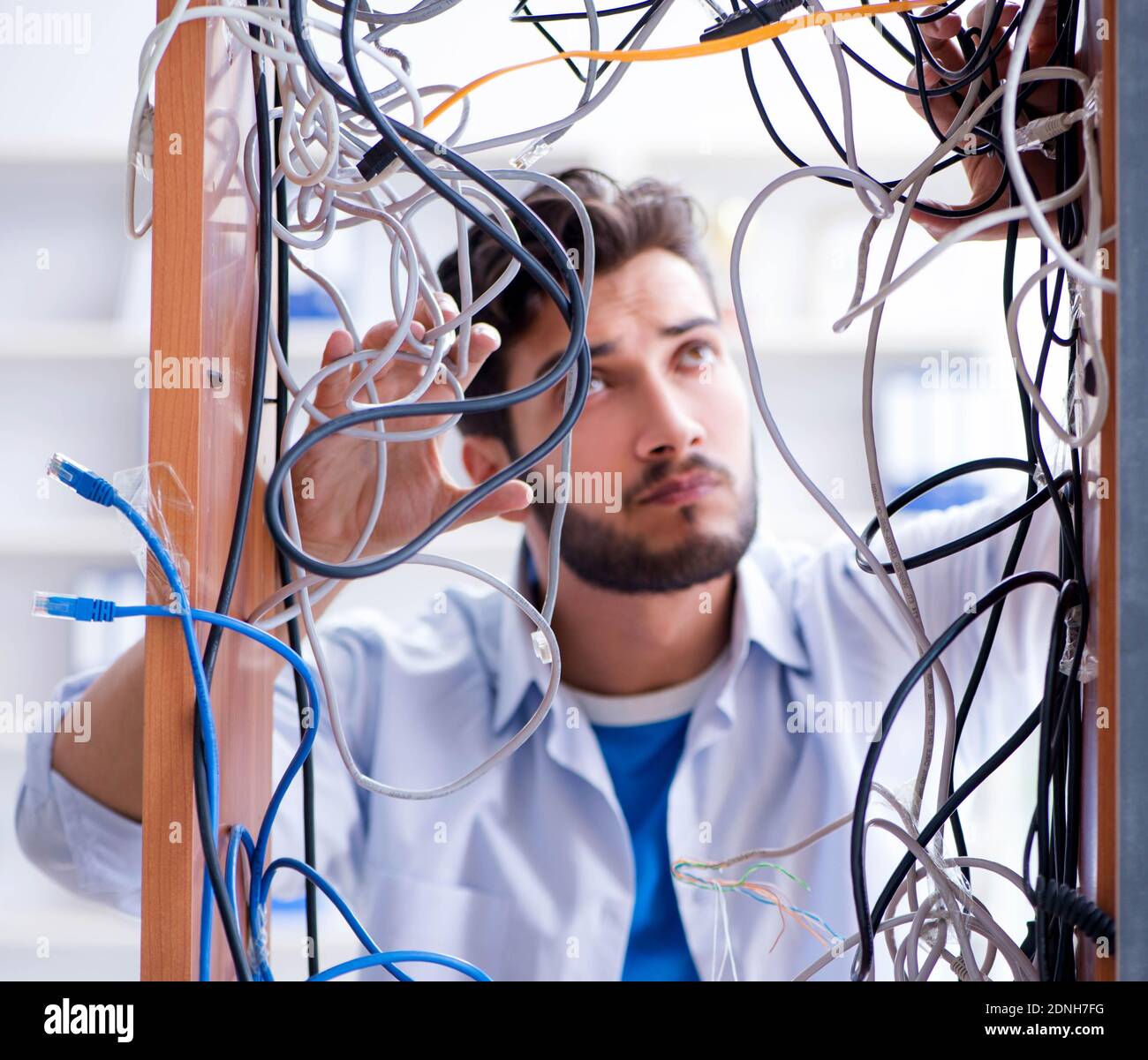 The computer repairman working on repairing network in it workshop ...