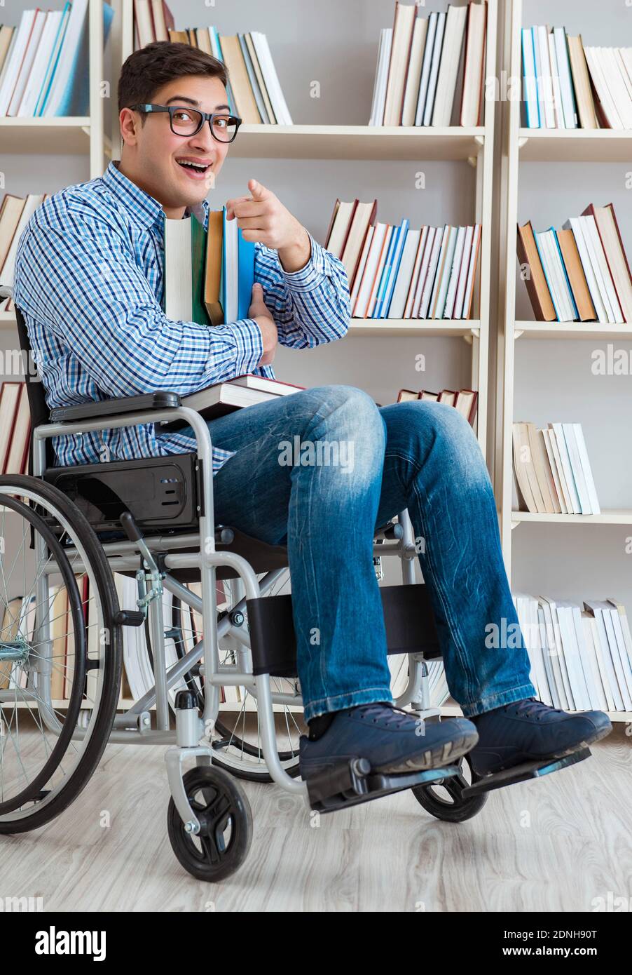 The disabled student studying in the library Stock Photo - Alamy