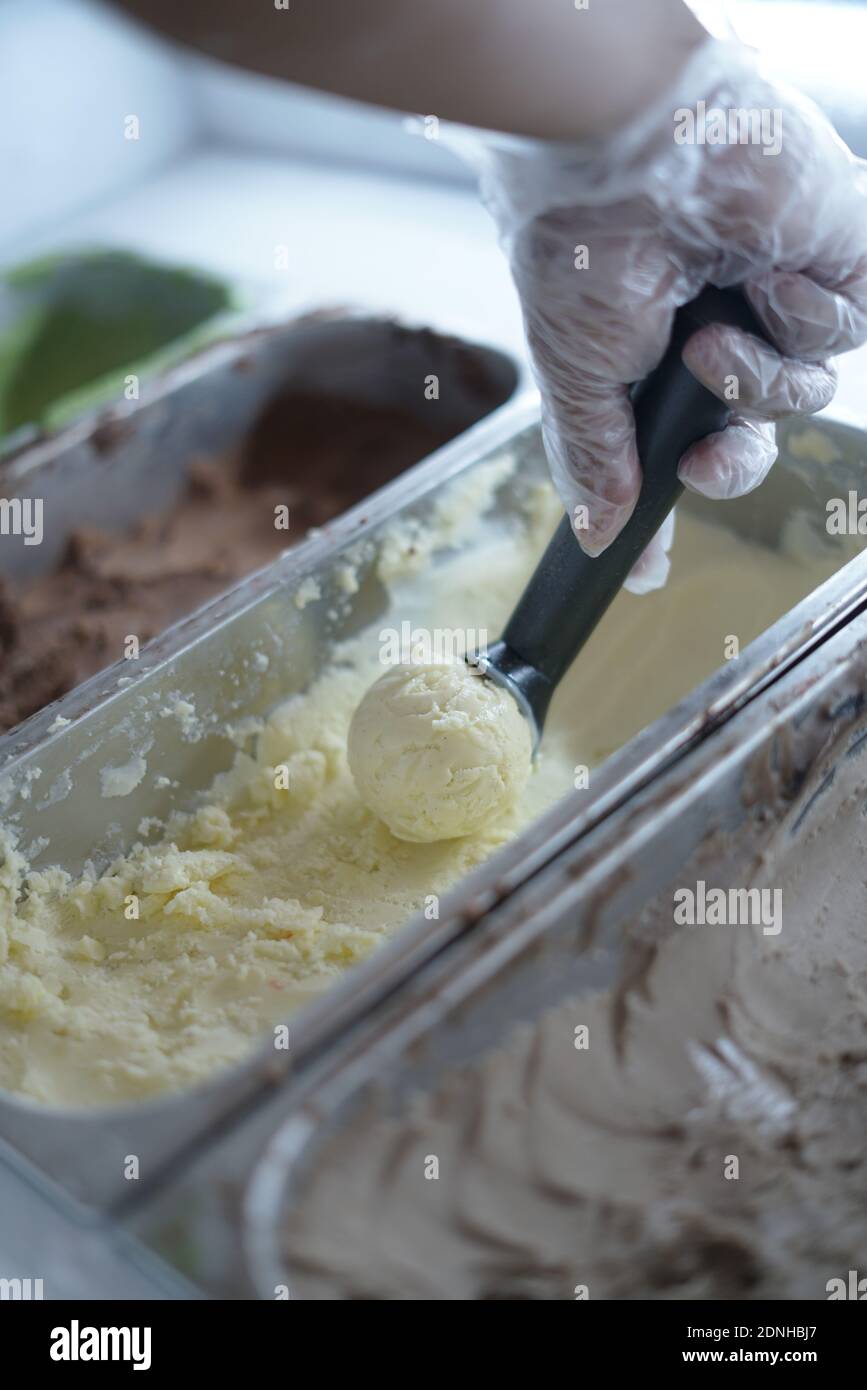 Hand scooping ice cream hi-res stock photography and images - Alamy