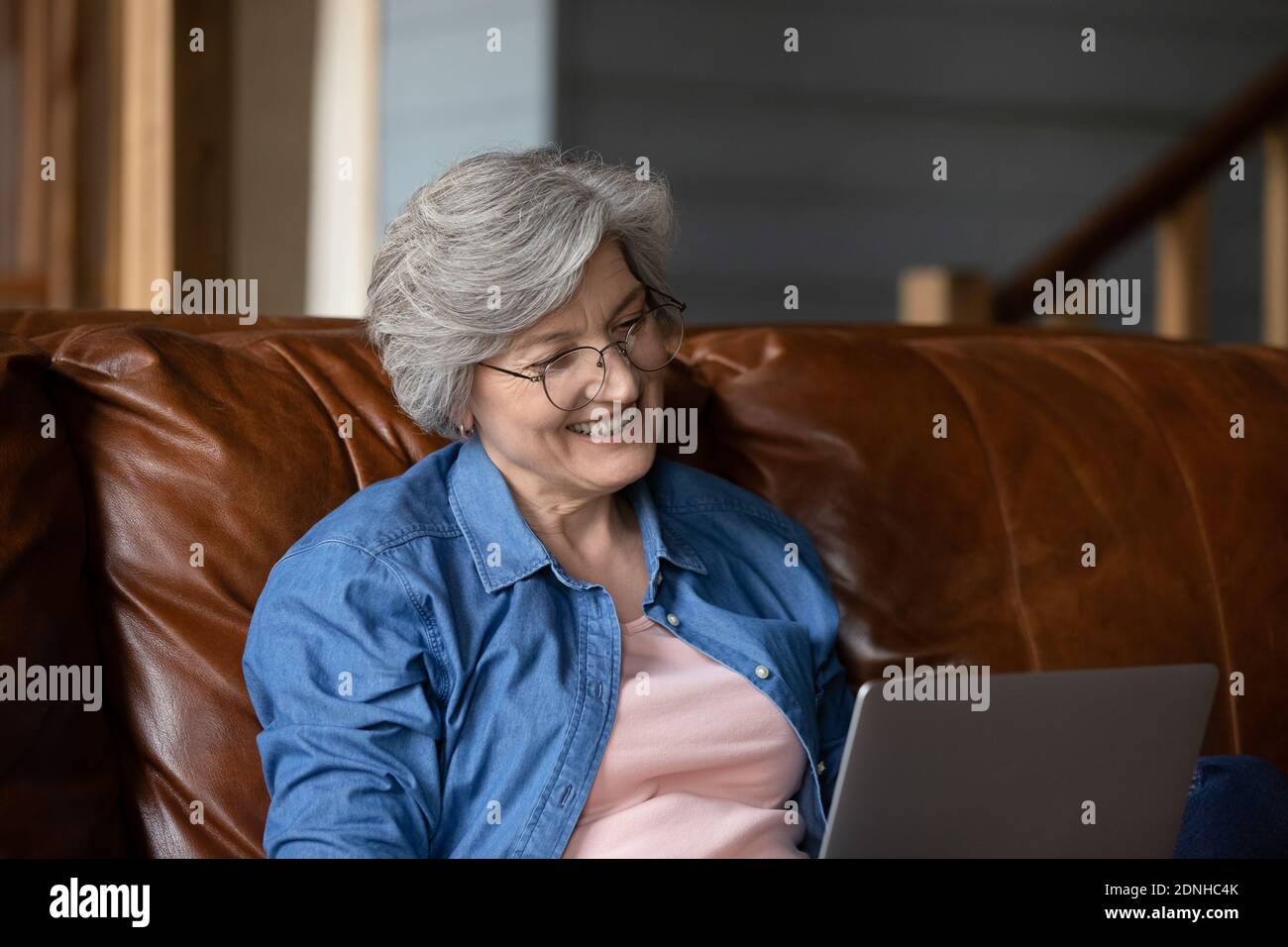 Happy older senior 60s woman using computer application Stock Photo - Alamy