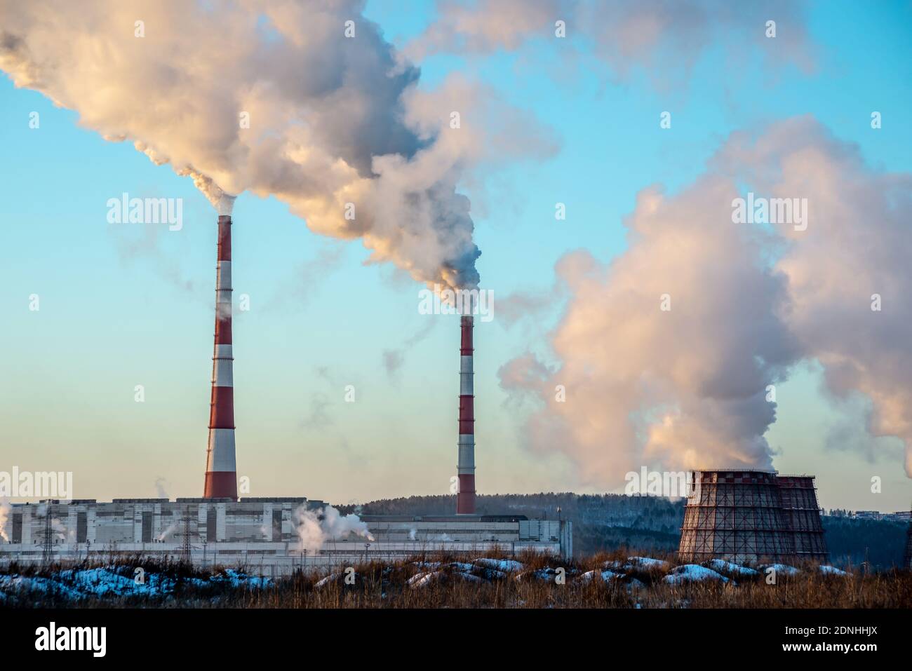 Powerful industrial factory chimney is smoking and emitting carbon ...
