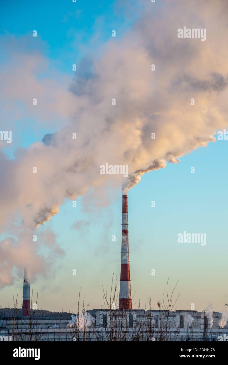 Powerful industrial factory chimney is smoking and emitting carbon ...