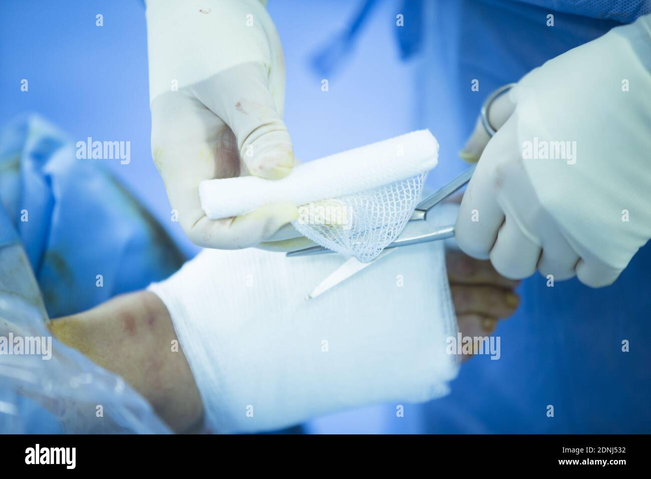 Hand cutting bandage hi-res stock photography and images - Alamy