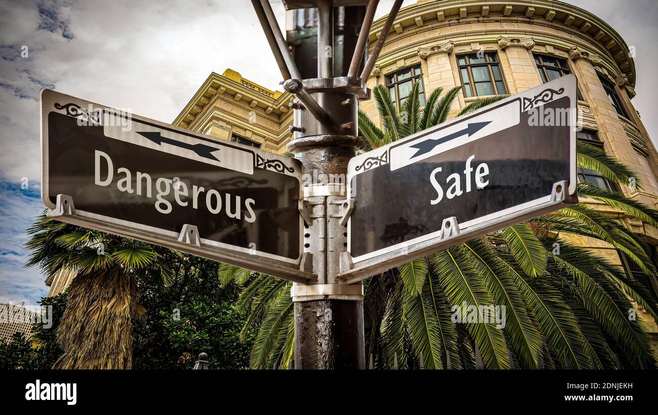 Street Sign the Direction Way to Safe versus Dangerous Stock Photo - Alamy