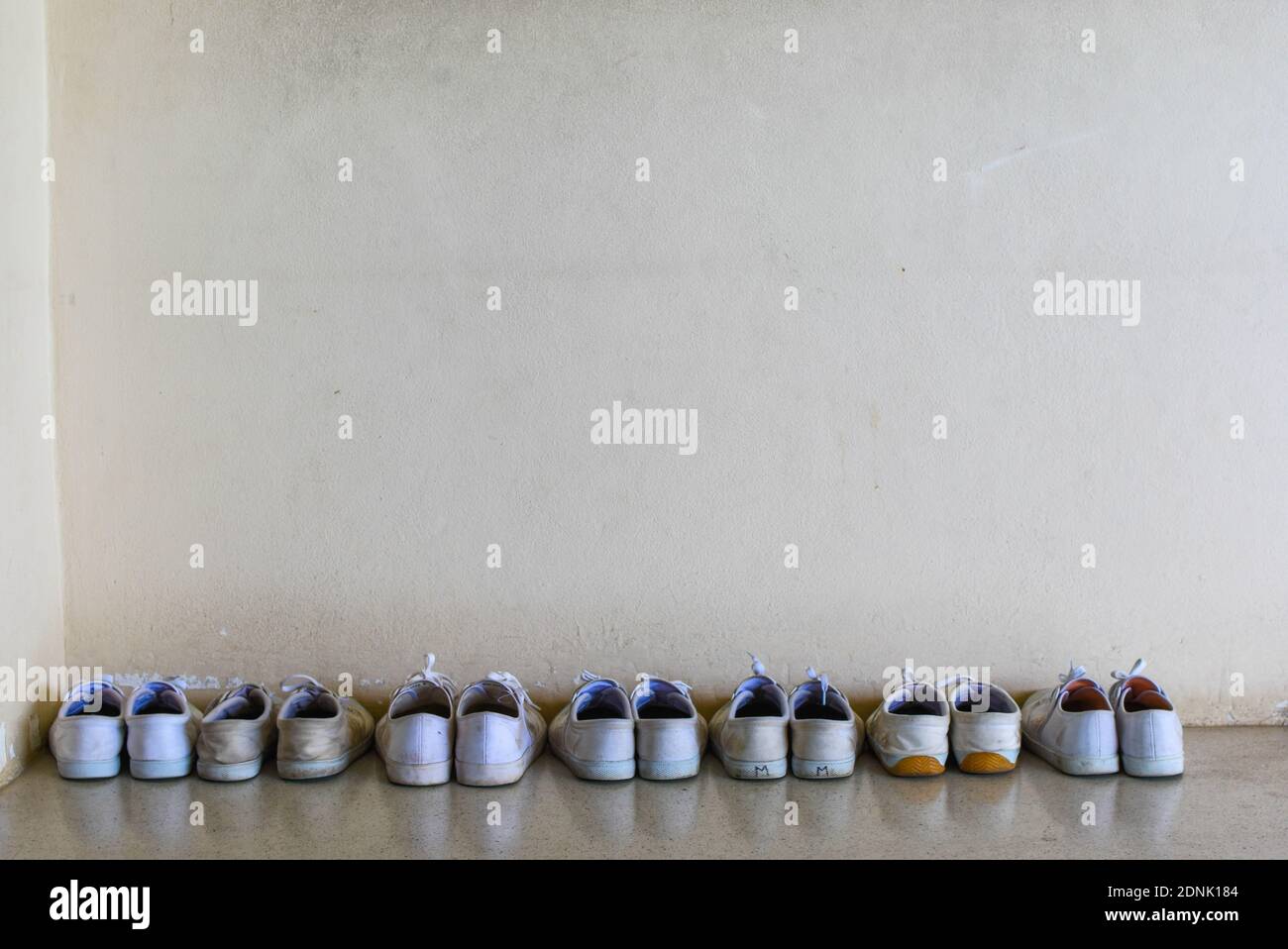 Pair shoes row against wall hi-res stock photography and images - Alamy