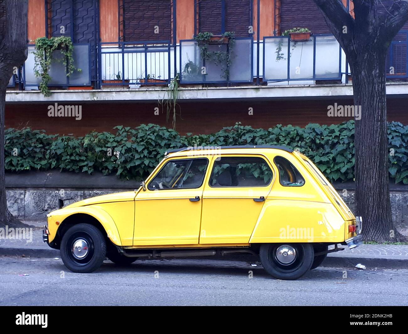 Yellow Car On Street Stock Photo - Alamy
