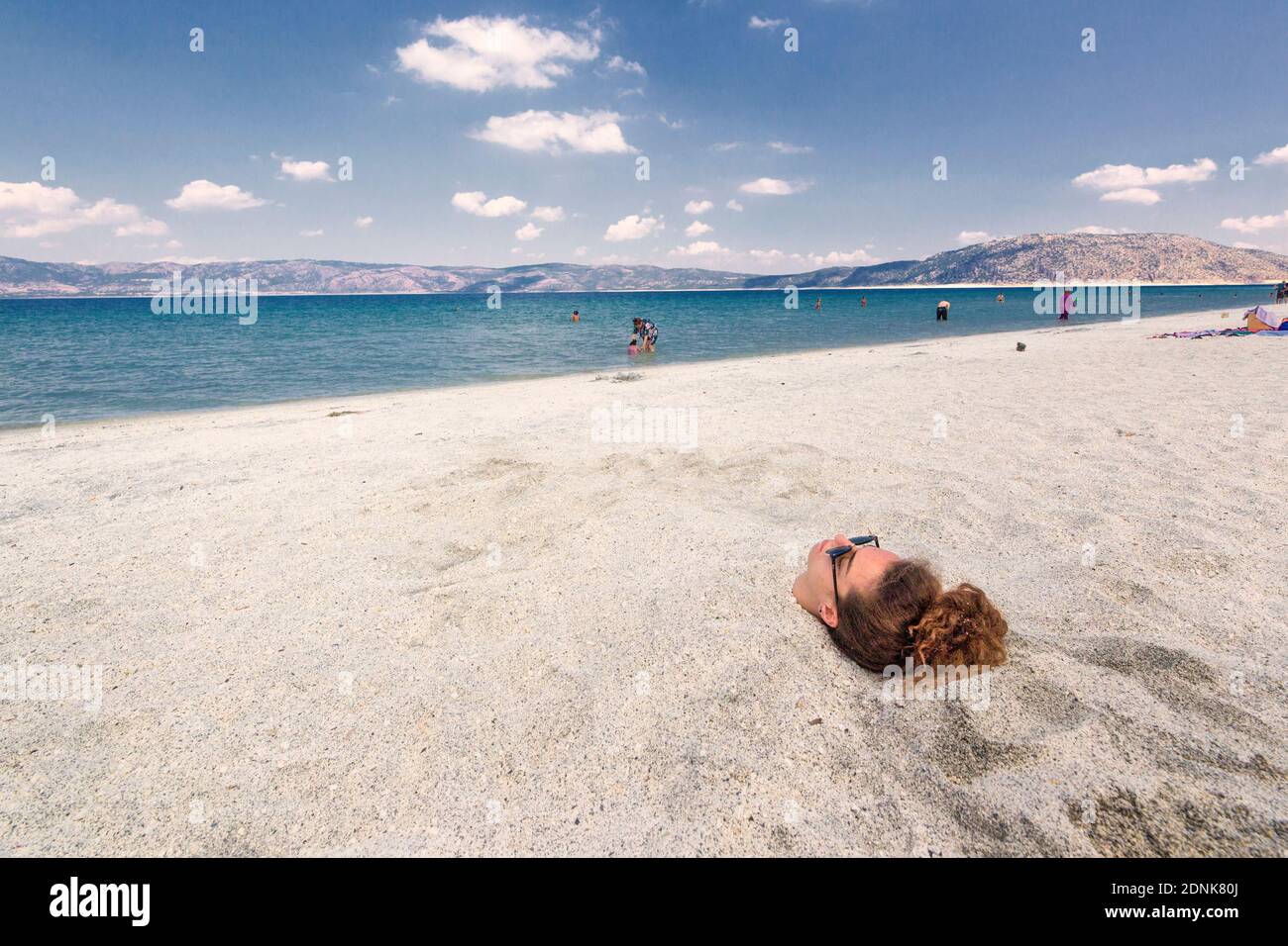 Buried sand woman hi-res stock photography and images - Alamy