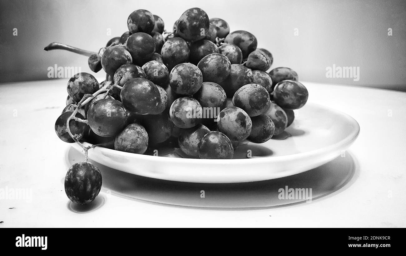 Grape on plate Black and White Stock Photos & Images - Alamy