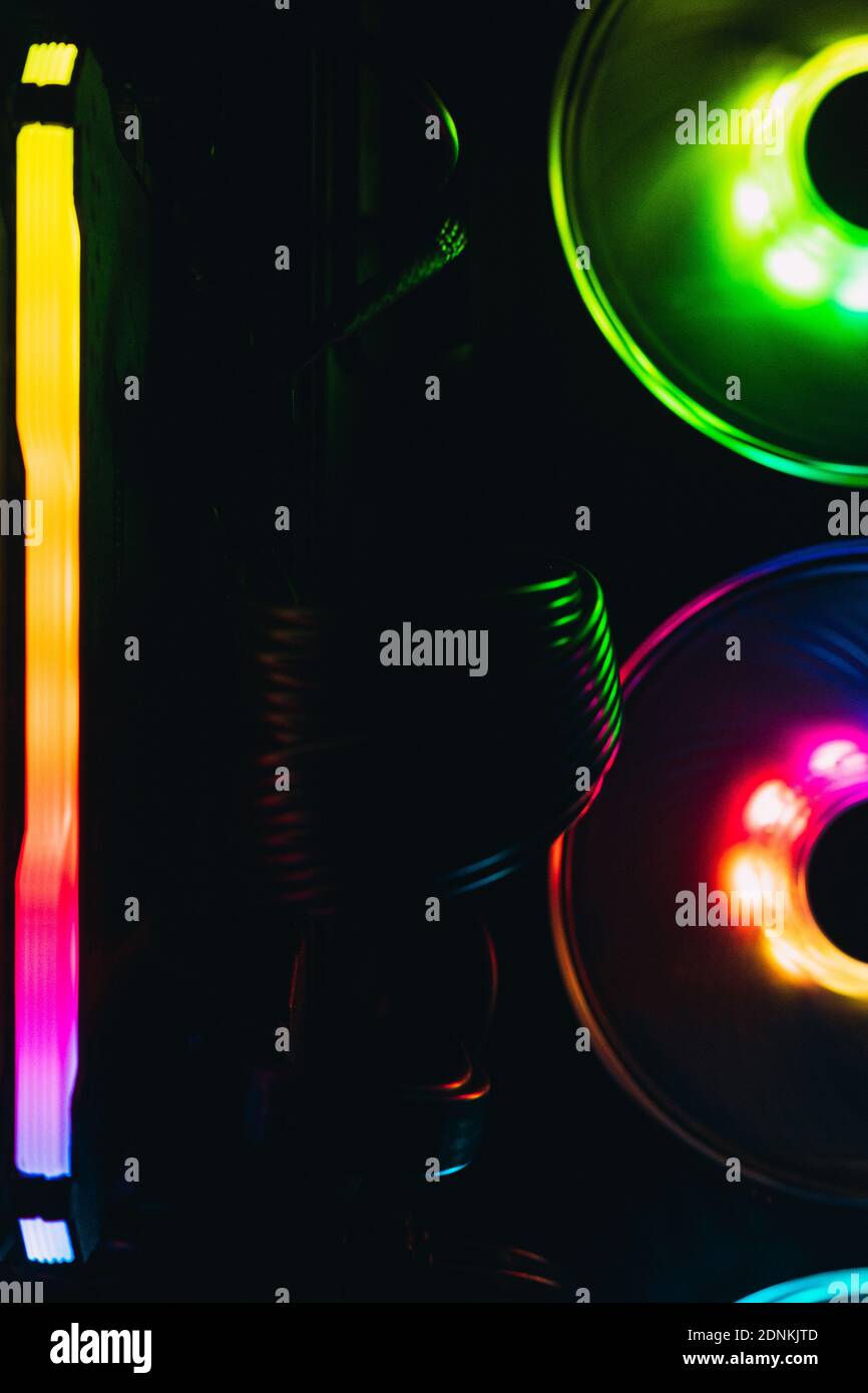 A vertical closeup shot of gaming computer parts with RGB lightin Stock ...