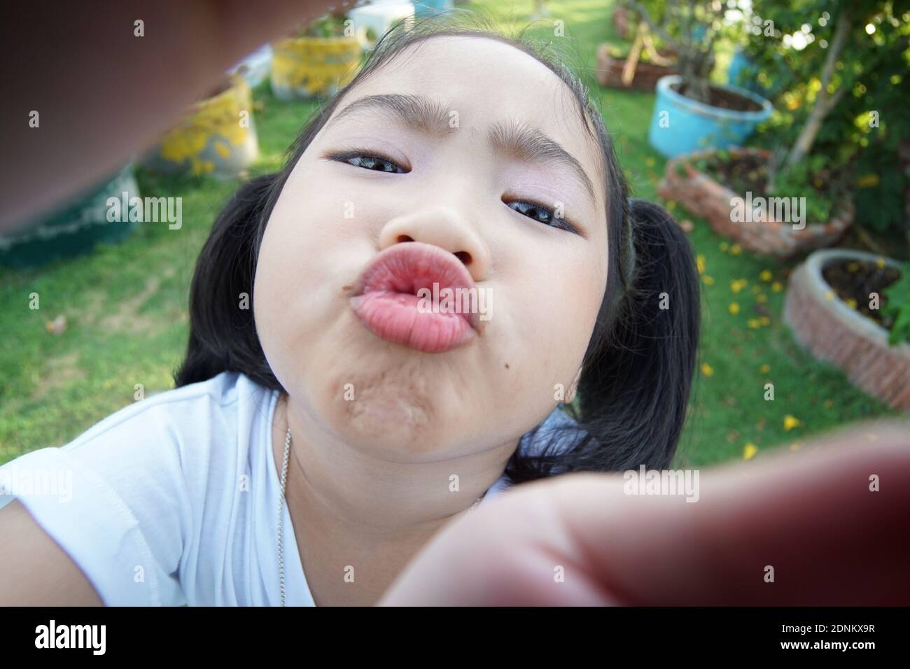 Close up girl puckering lips hi-res stock photography and images - Alamy