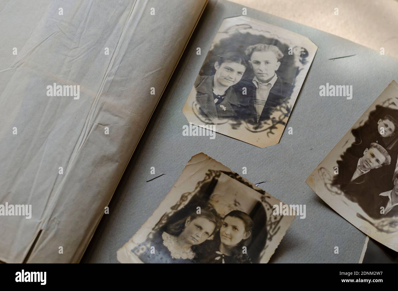 Antique photos in the family photo album. Old photos of relatives ...