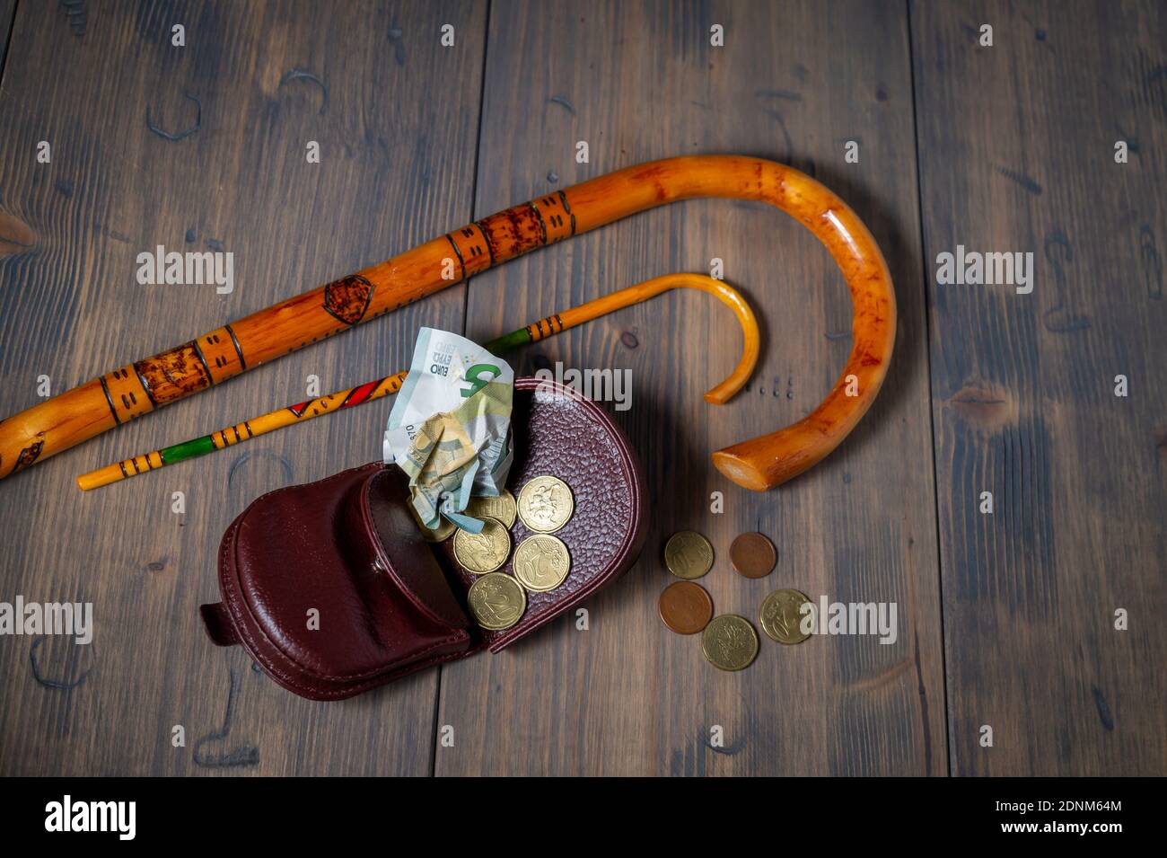 Conceptual Covid-19 flat lay still life with money spilling from an ...