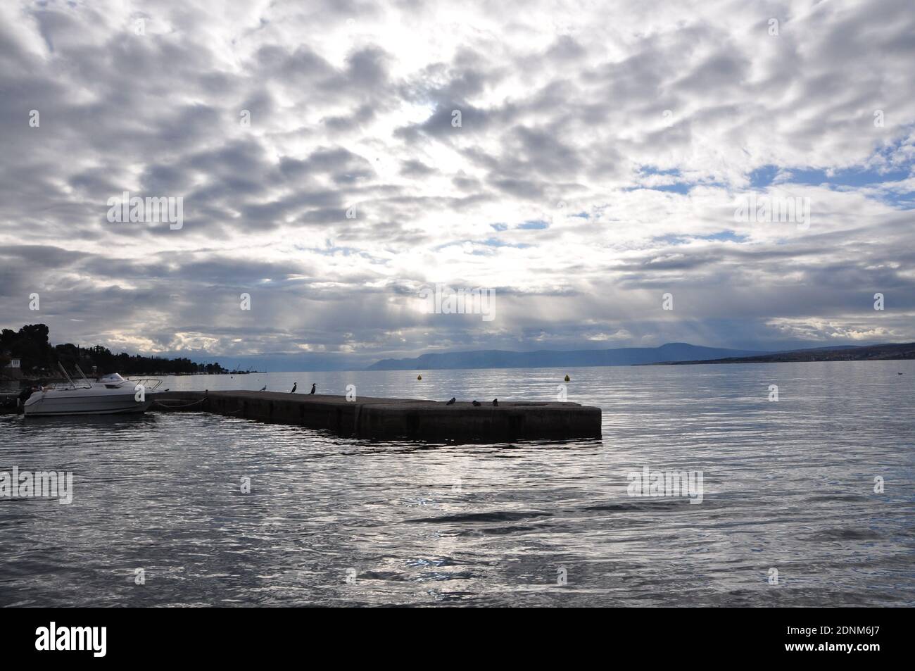 Stone pier on Croatian pebbles beach at Kvarner riviera Stock Photo - Alamy
