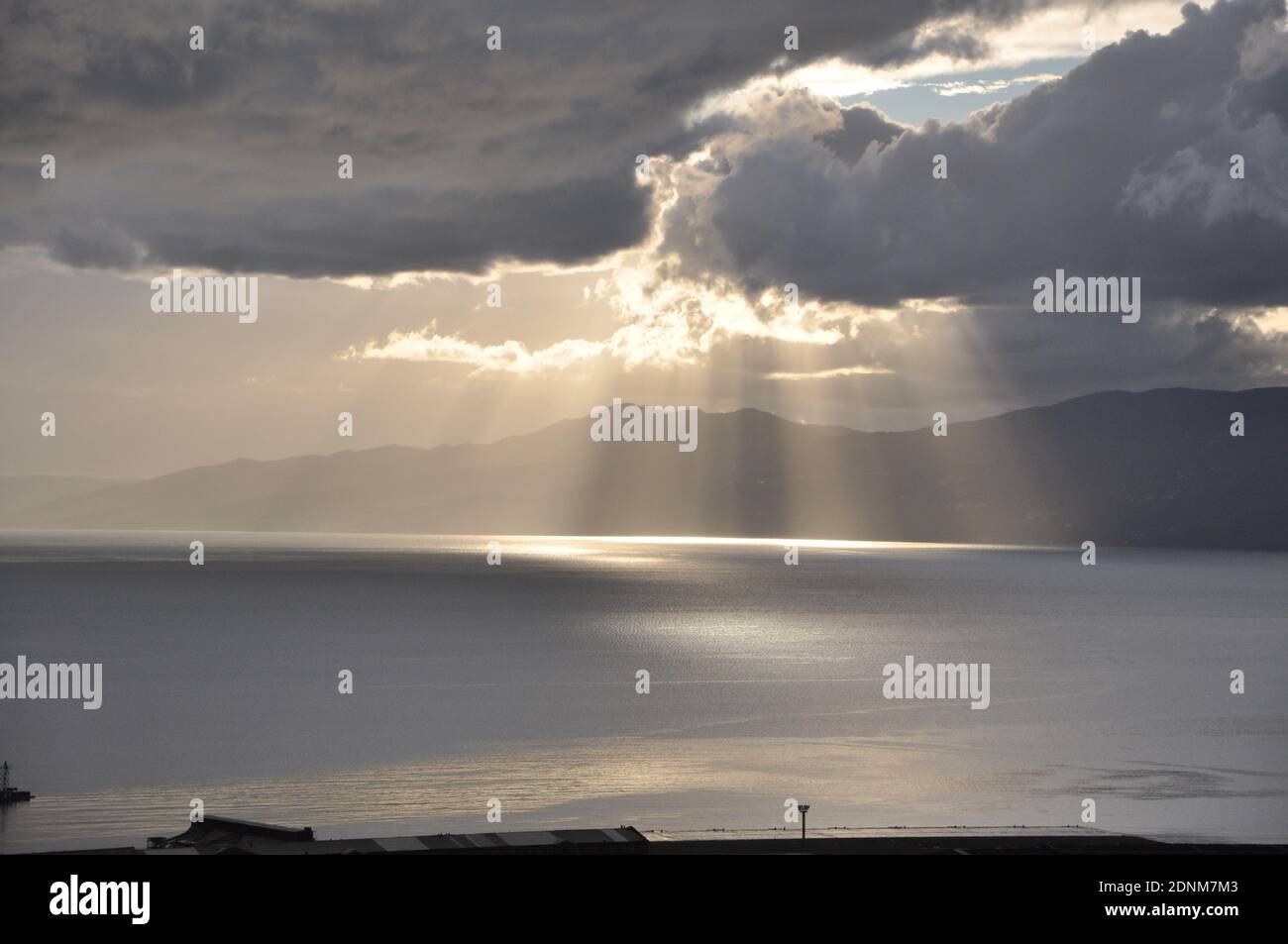 Sun rays through storm clouds hi-res stock photography and images - Alamy