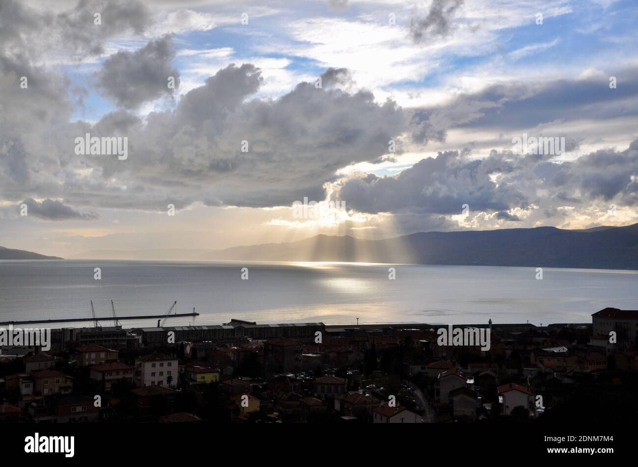 Sun rays passing through clouds on the sea.Dramatic cloudscape over sea ...